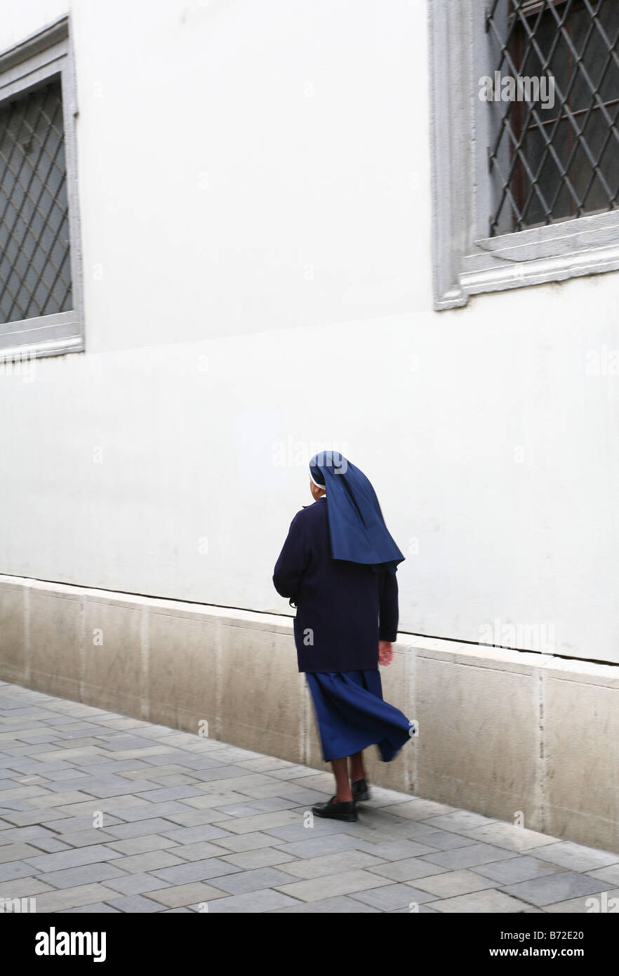 Street scene in Bratislava, Slovakia: nun walking in the streets Stock ...