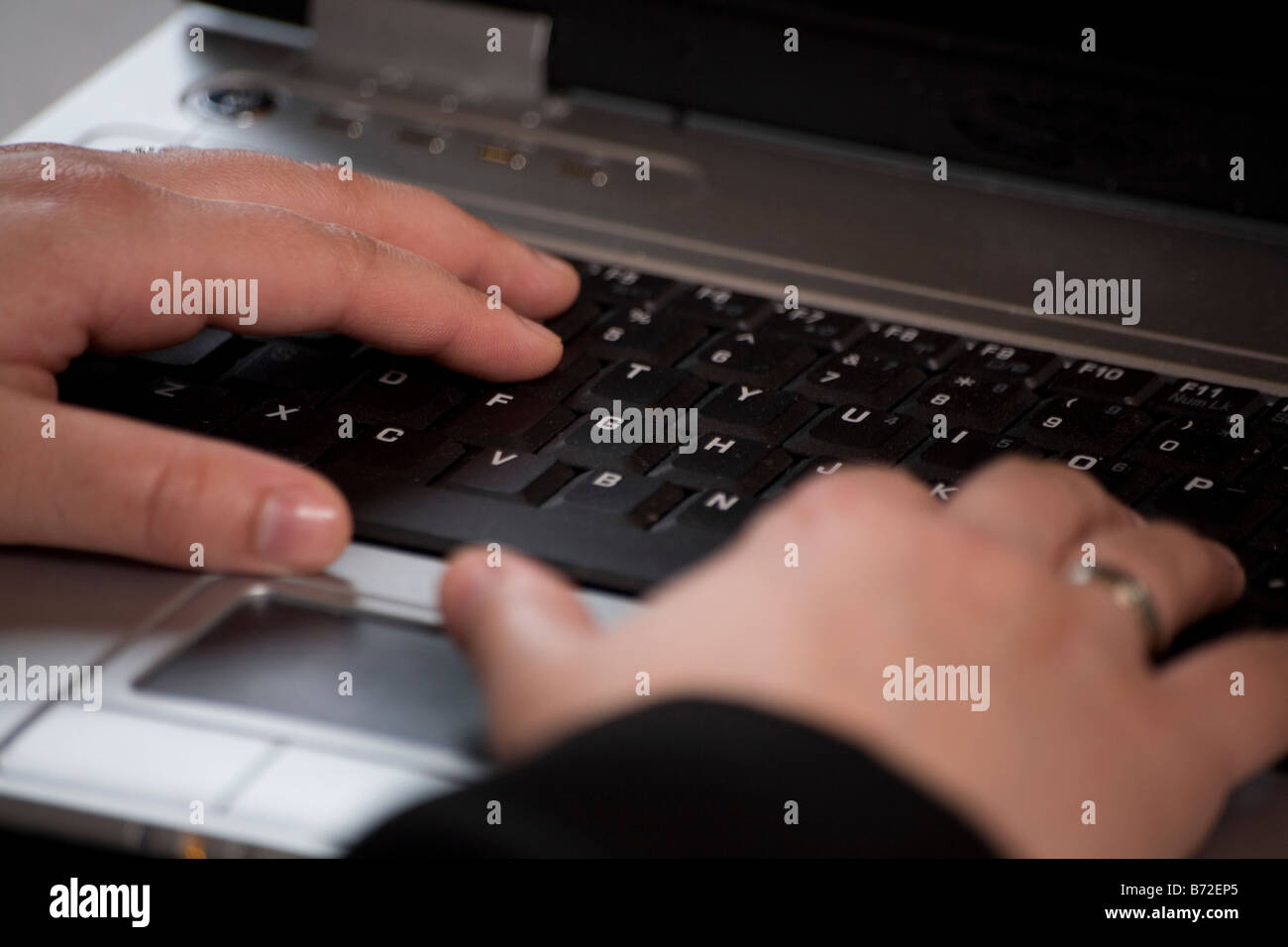 Working with a computer Stock Photo - Alamy