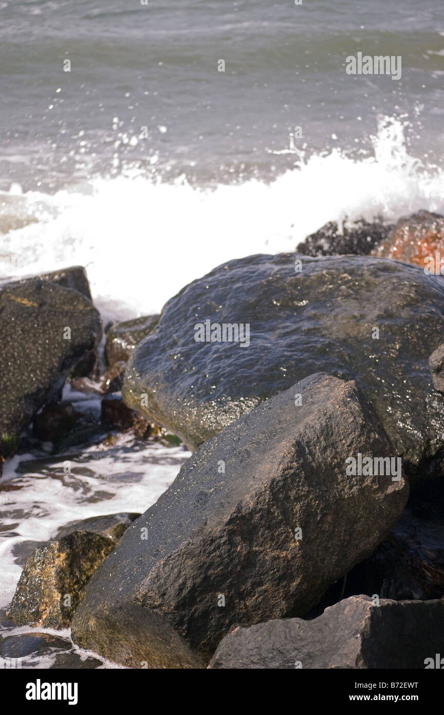 Waves crashing onto rocks Stock Photo - Alamy