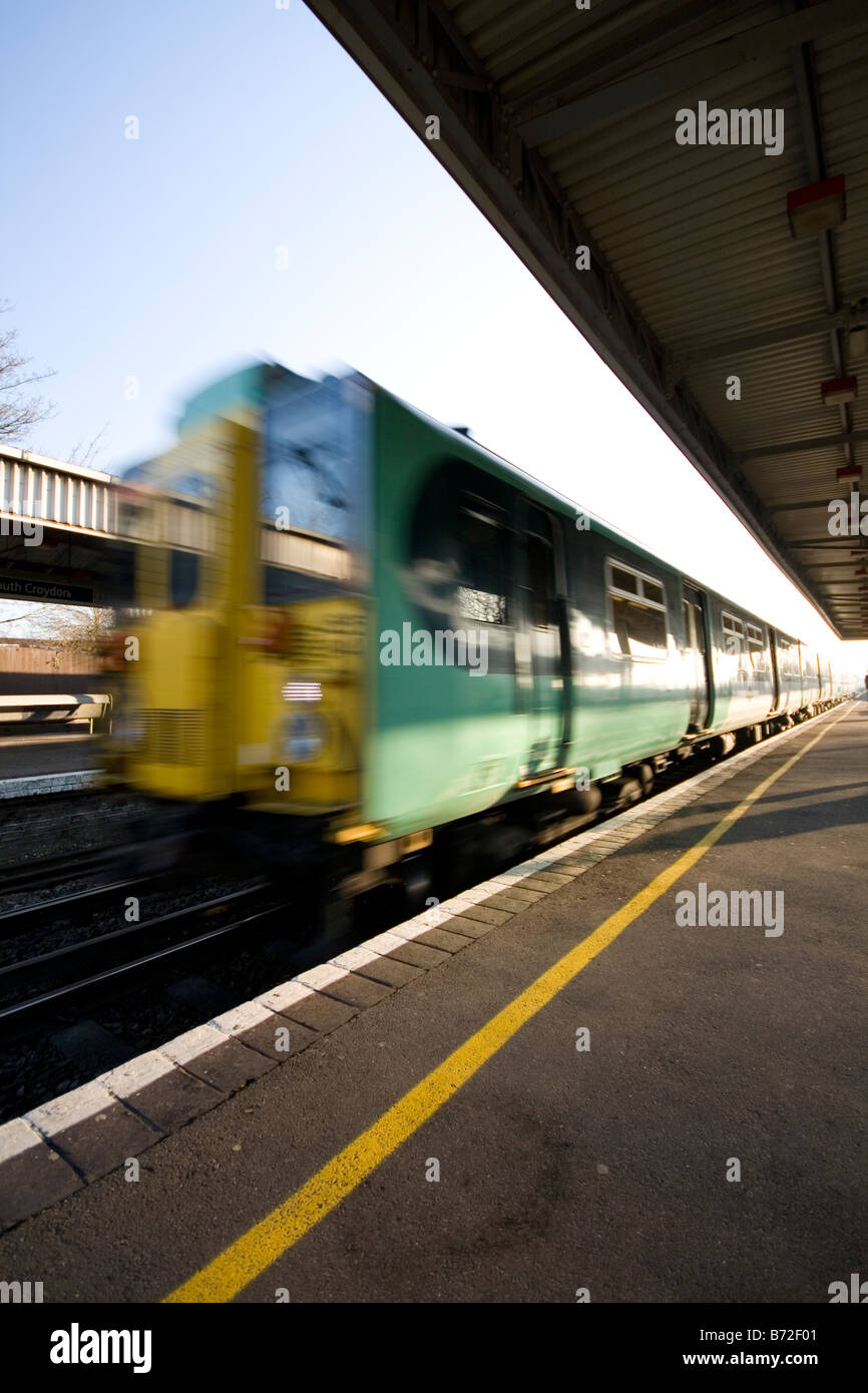 A train goes by the station Stock Photo - Alamy