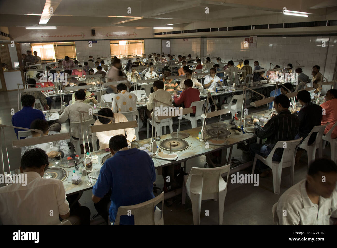 Workers in a diamond cutting workshop in Surat City, Gujarat. India ...