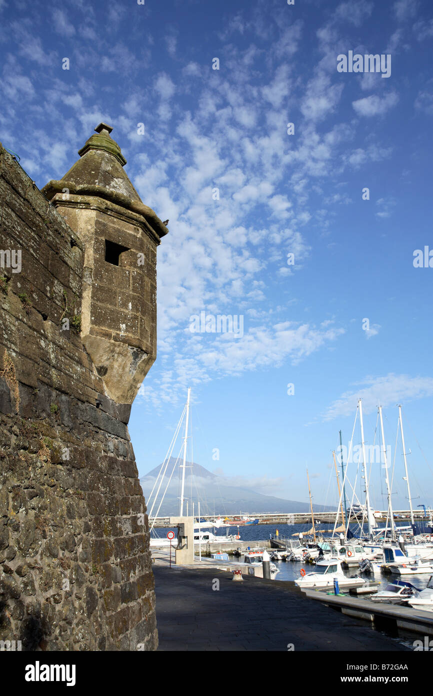 Fortress tower in Azores island of Faial overlooking yacht harbor Stock ...