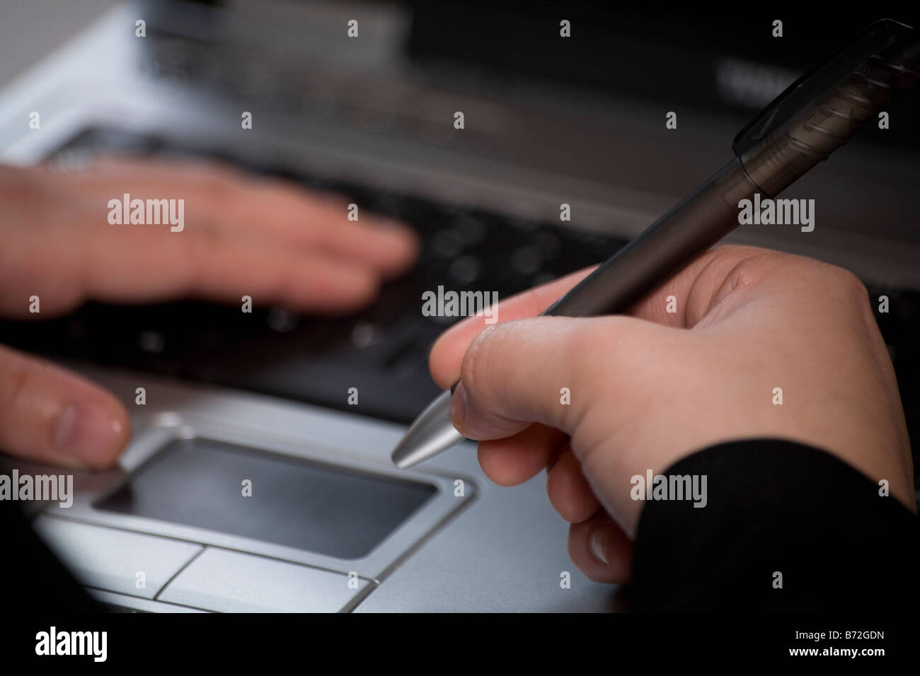 Working with a computer Stock Photo - Alamy