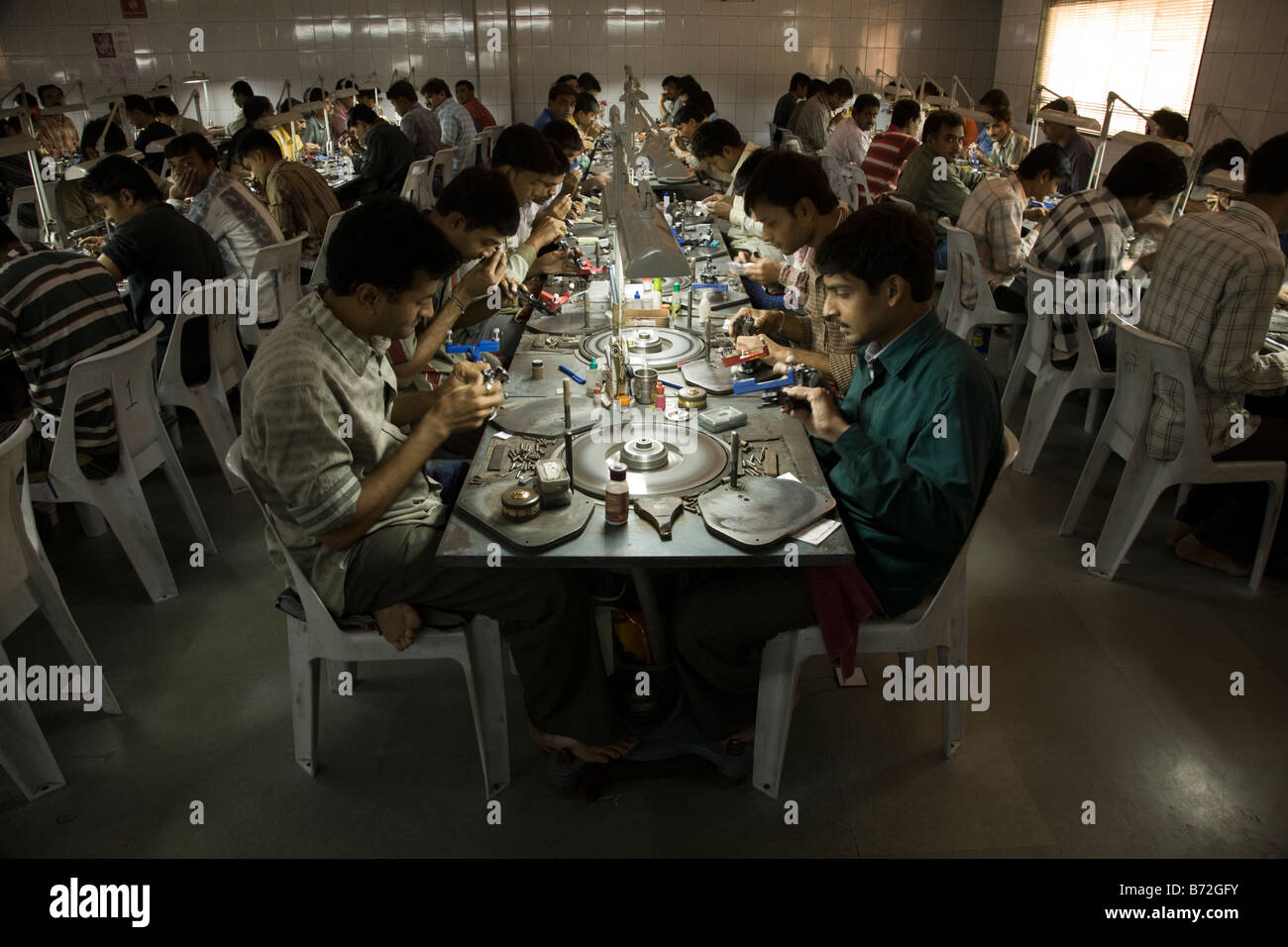 Workers in a diamond cutting workshop in Surat City, Gujarat. India ...