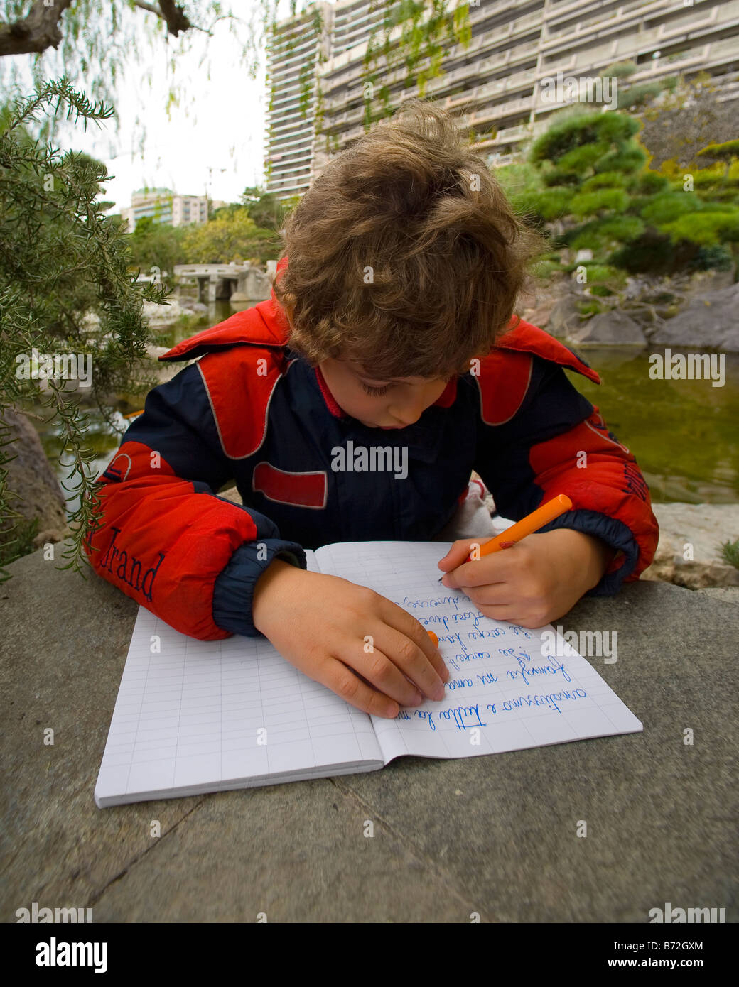 kid does his homework outside Stock Photo - Alamy