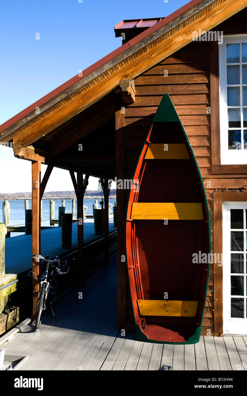 Boat leaning on house Stock Photo - Alamy