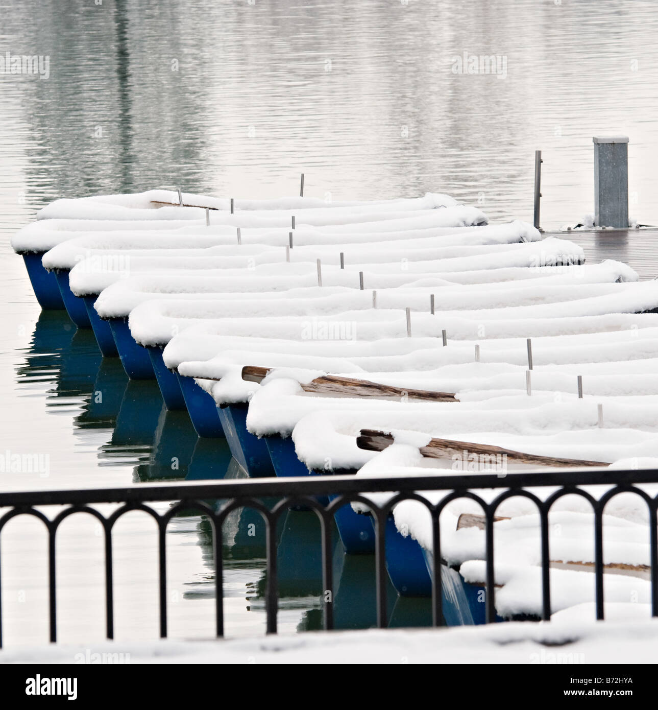 Row boats covered in snow Stock Photo - Alamy