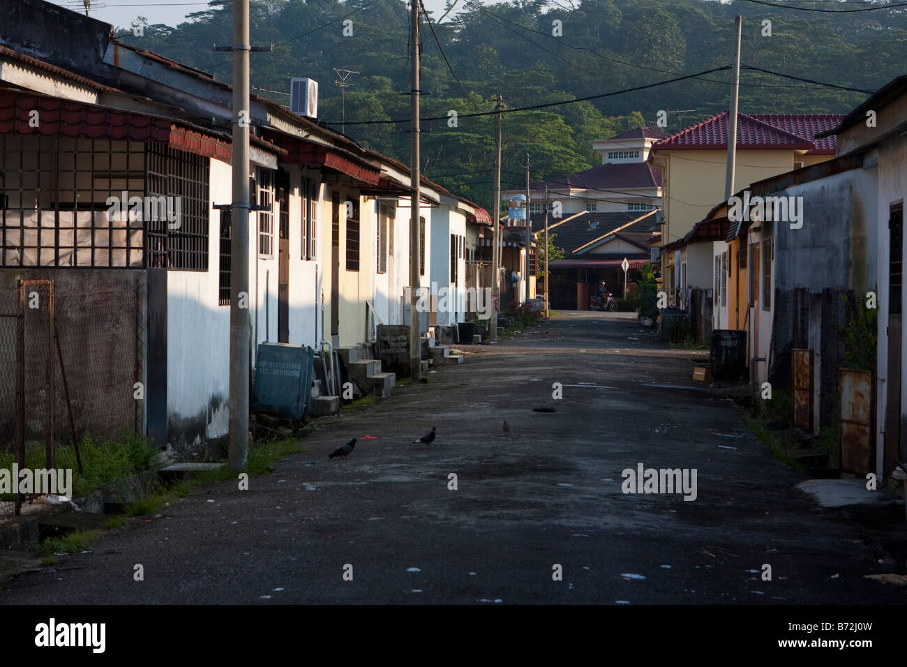 Alley behind houses in Malaysian estate Stock Photo - Alamy