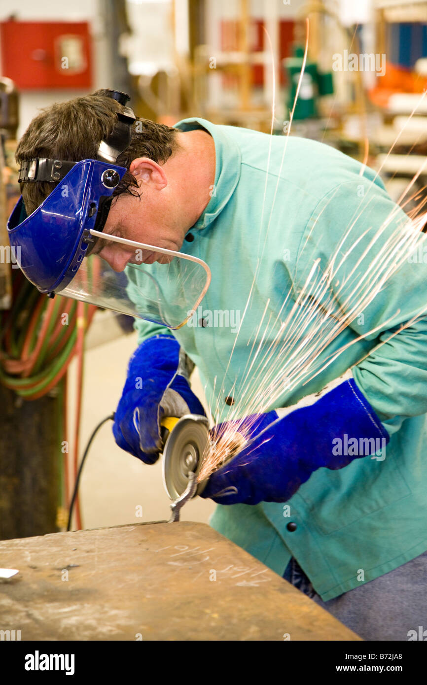 Machinist working in a metal factory Authentic and accurate Stock Photo ...