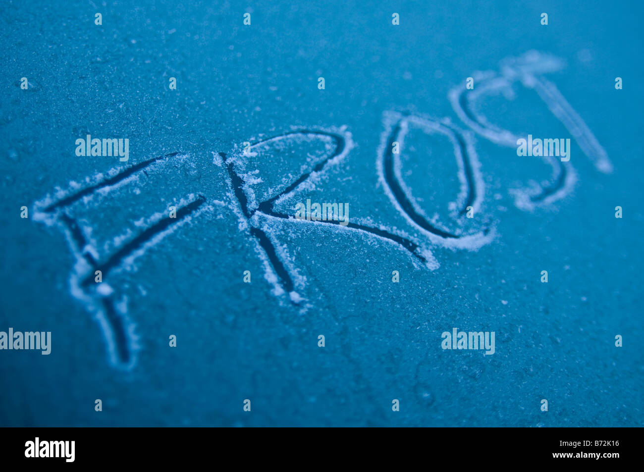 Word "frost" written on a window screen Stock Photo - Alamy