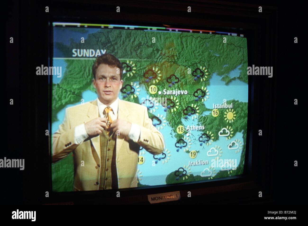 Richard Edgar adjusts his tie before presenting the weather forecast ...