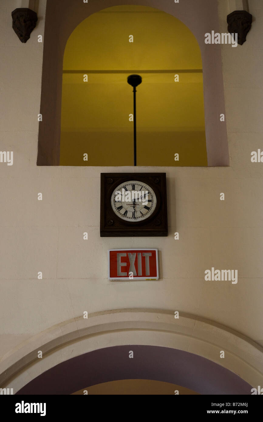 Clock and exit sign Stock Photo - Alamy