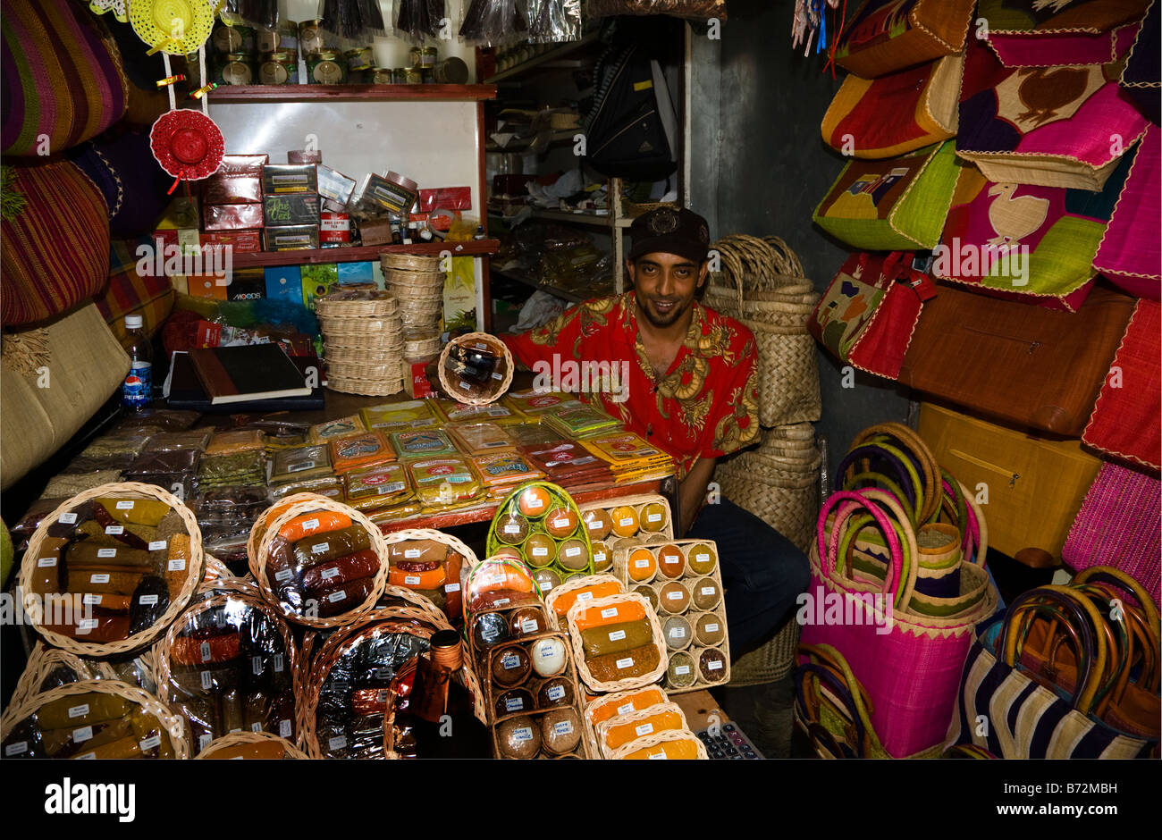 Market trader in the market in Port Louis Mauritius selling herbs and ...