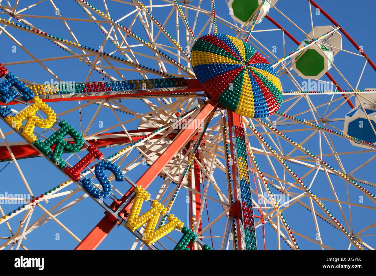 fairground ferris wheel on clock tower square at the V&A waterfront ...