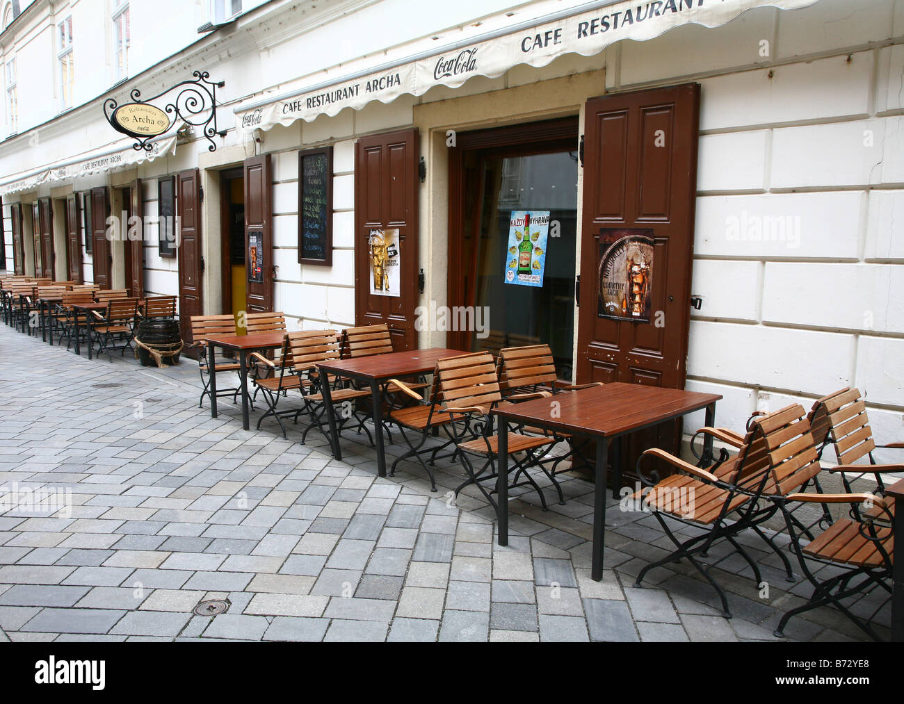 Street scene in Bratislava, Slovakia , chairs of a cafe bar in the ...