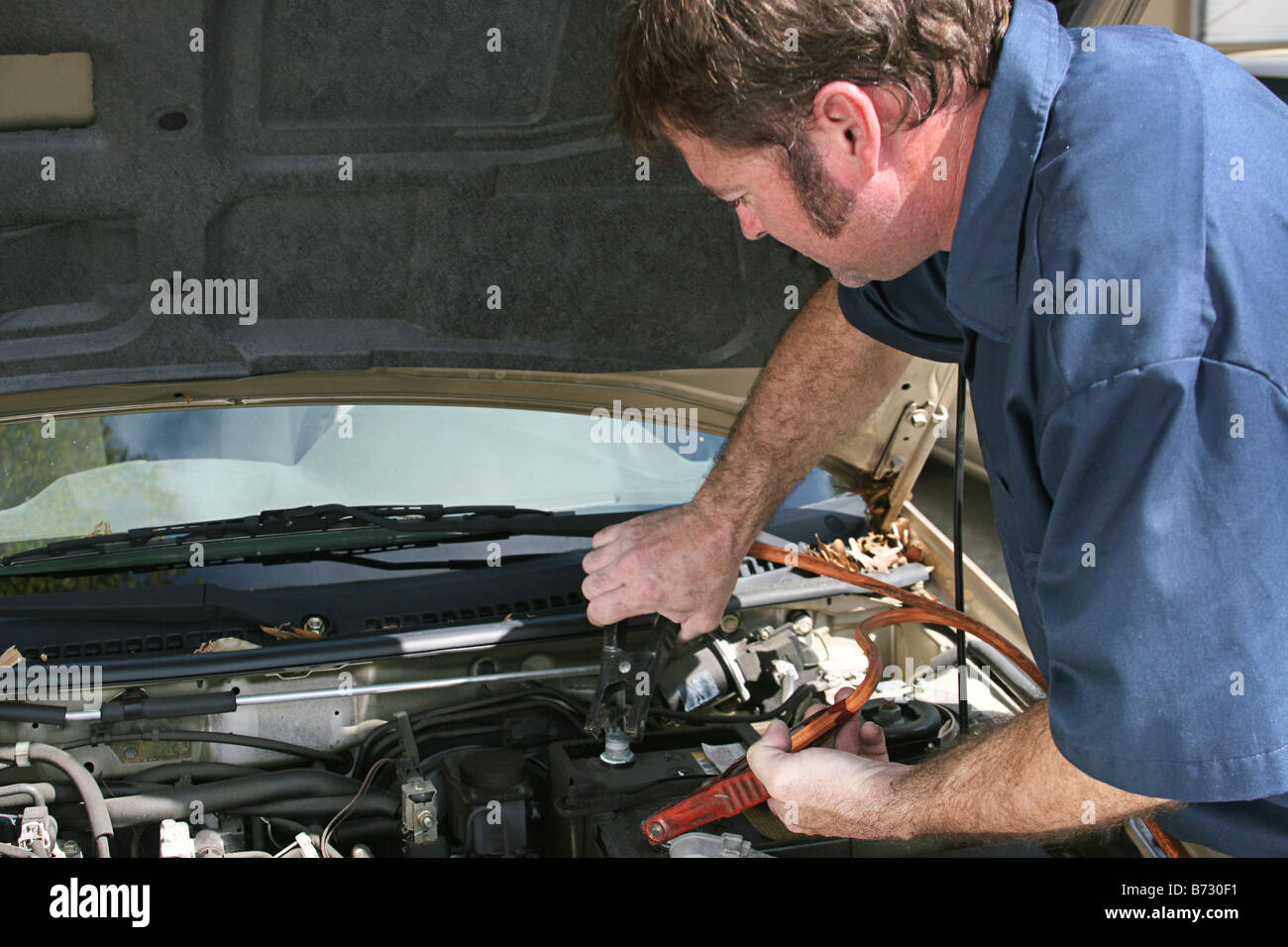 Mechanic working on electric car hi-res stock photography and images ...