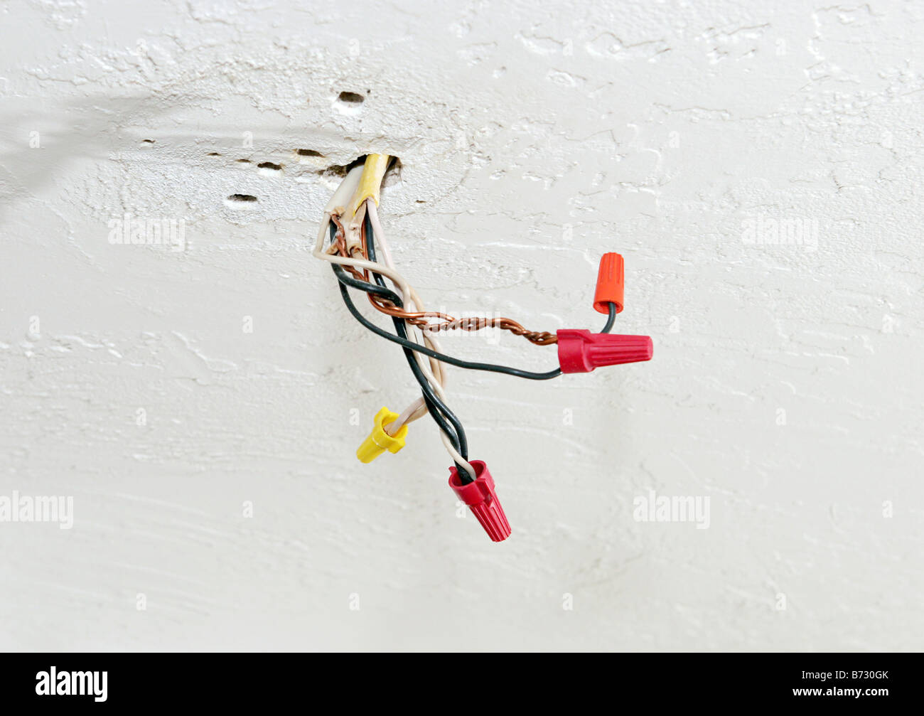 Exposed wires with wirenuts dangling from a hole in the ceiling Code ...