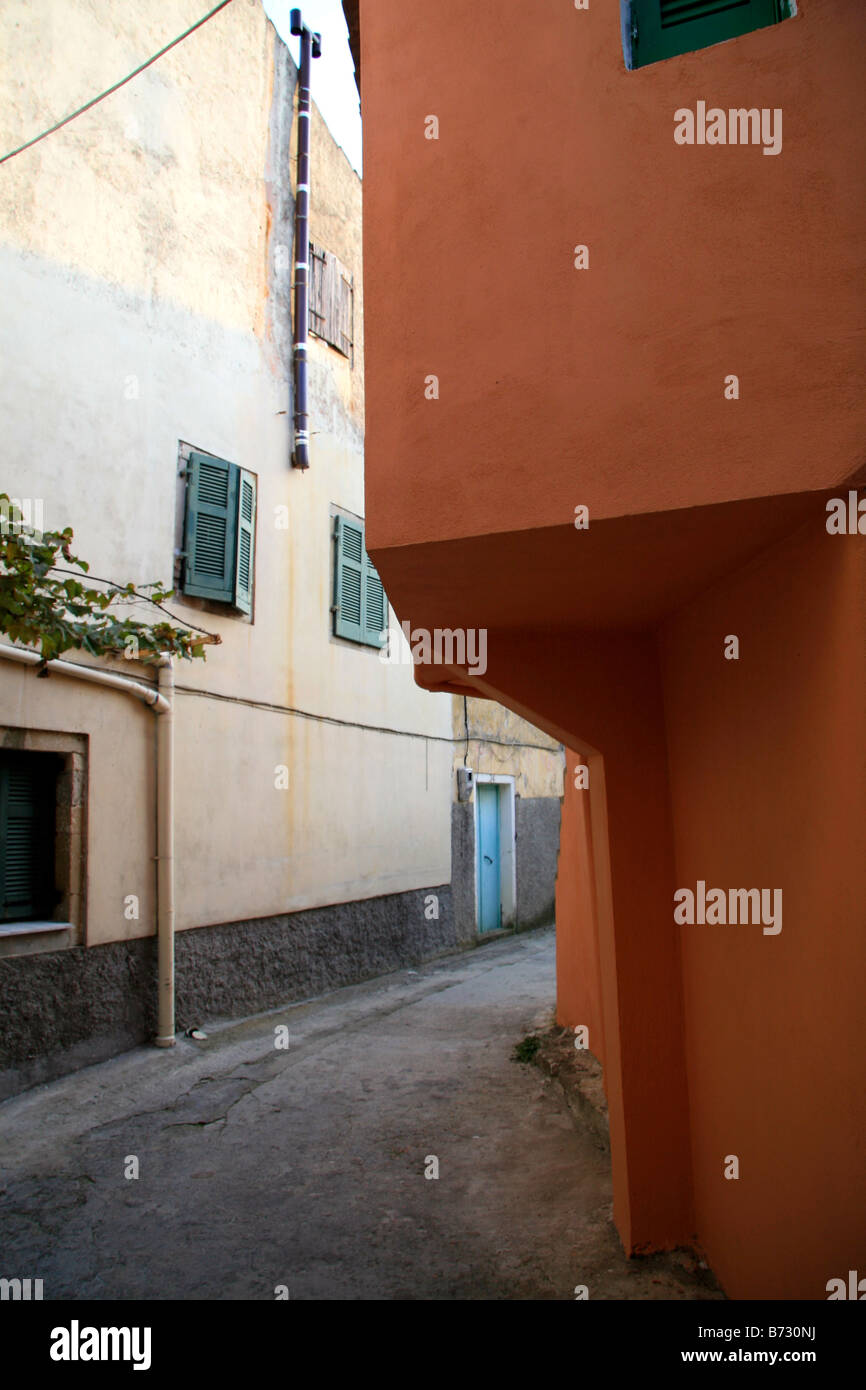 The corner of a brightly painted building, Sinarades, Corfu, Greece ...