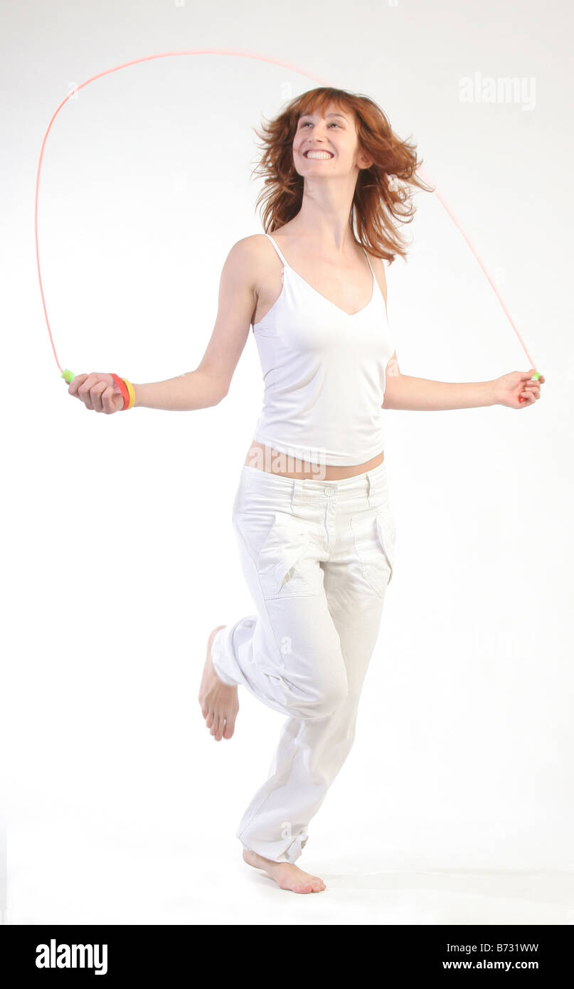 Girl jumping with skipping rope Stock Photo - Alamy
