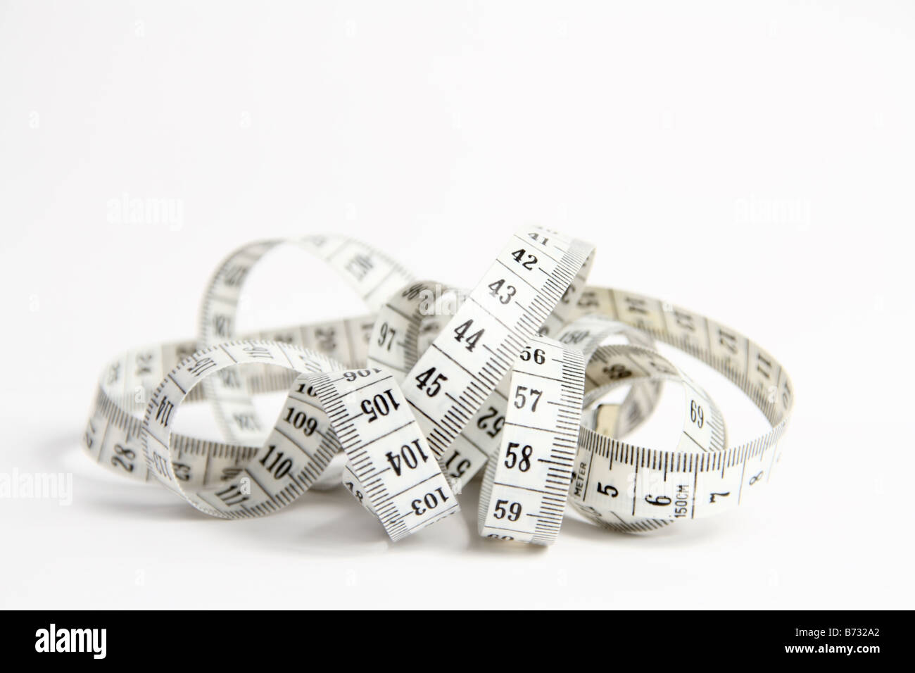 Measuring tape on white background Stock Photo - Alamy