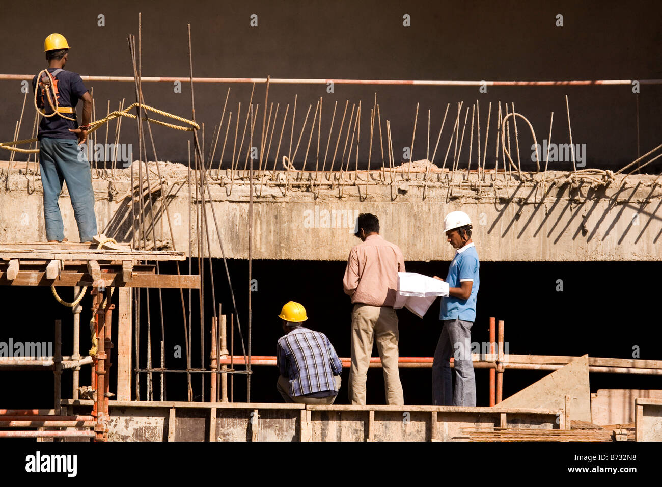 Indian construction workers on building hi-res stock photography and ...