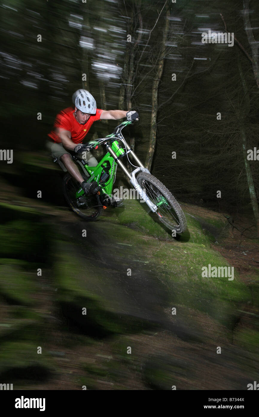 A Mountain Biker riding fast along a rocky trail Stock Photo - Alamy