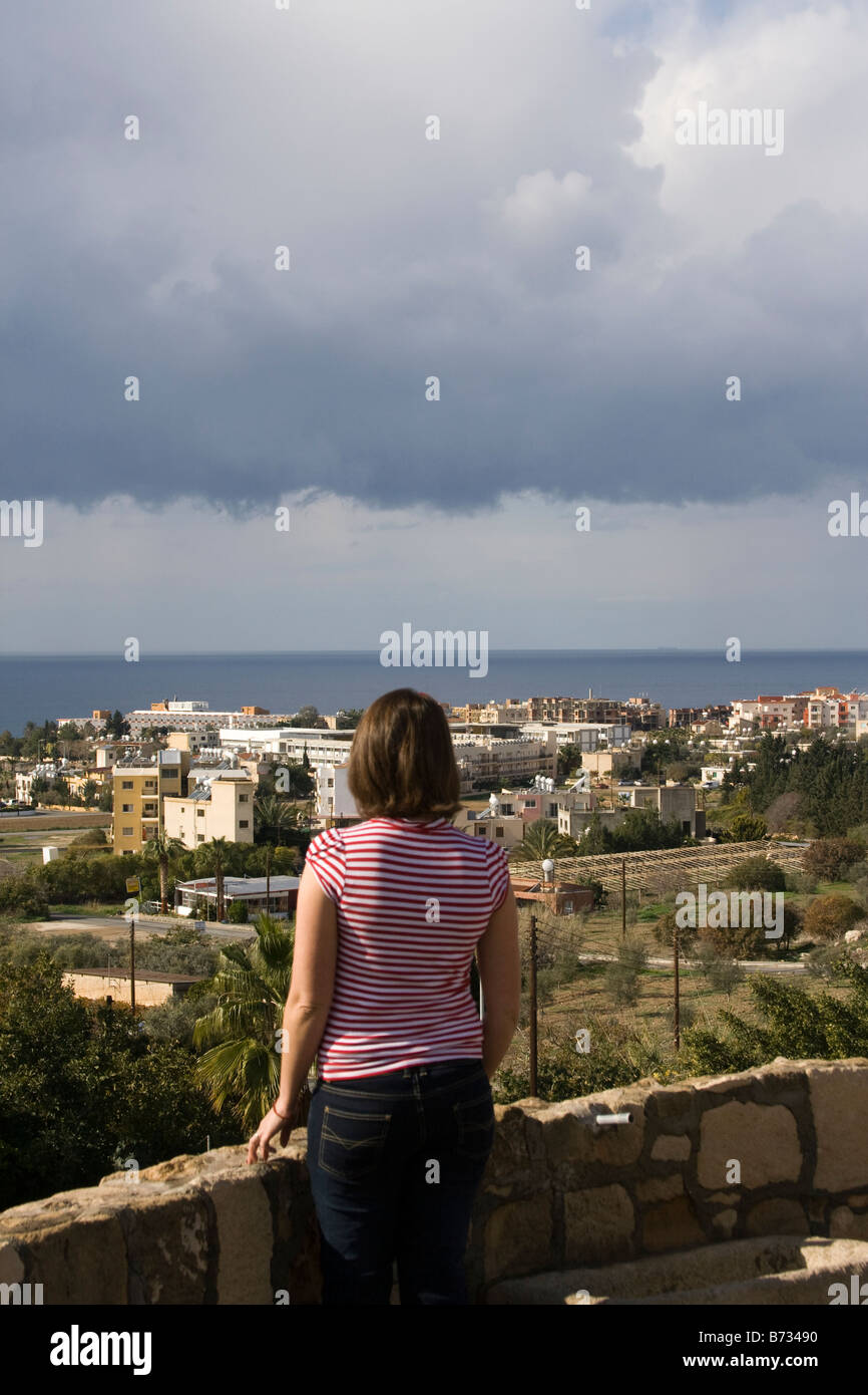 Admiring the View Woman looking out from Stone Balcony in Paphos across ...