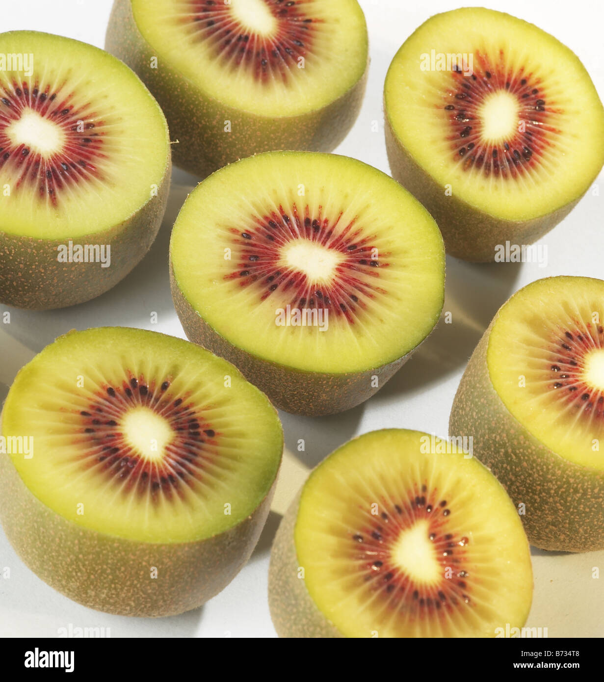 red kiwi fruit cut in half Stock Photo - Alamy