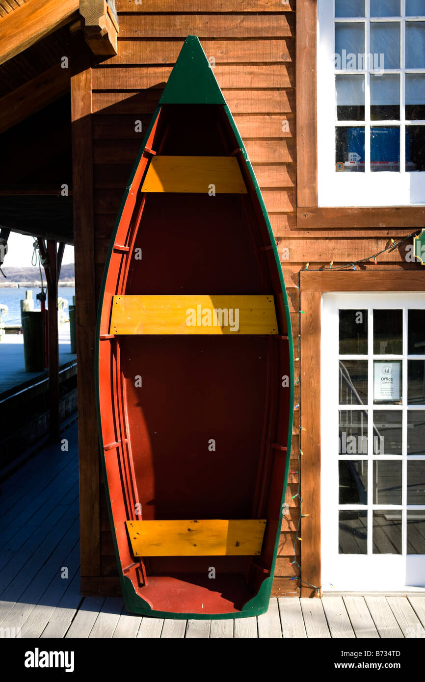 Boat leaning on house Stock Photo - Alamy