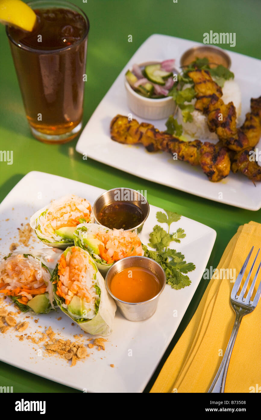 fresh shrimp avocado spring rolls Singapore chicken satay and a glass ...
