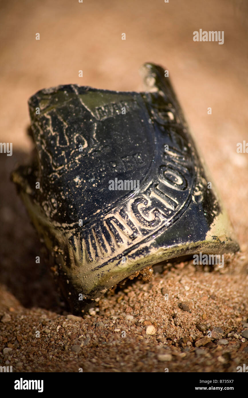broken bottle hazard showing detail of embossed lettering Stock Photo ...