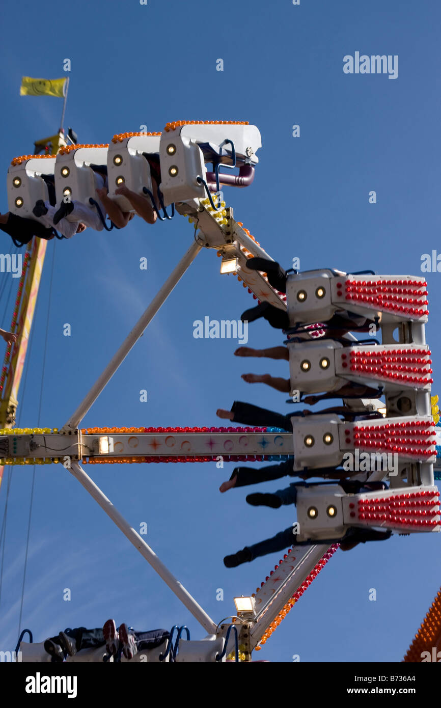 Fairground ride against a blue sky backgrouond at Stokesley Fair Stock ...