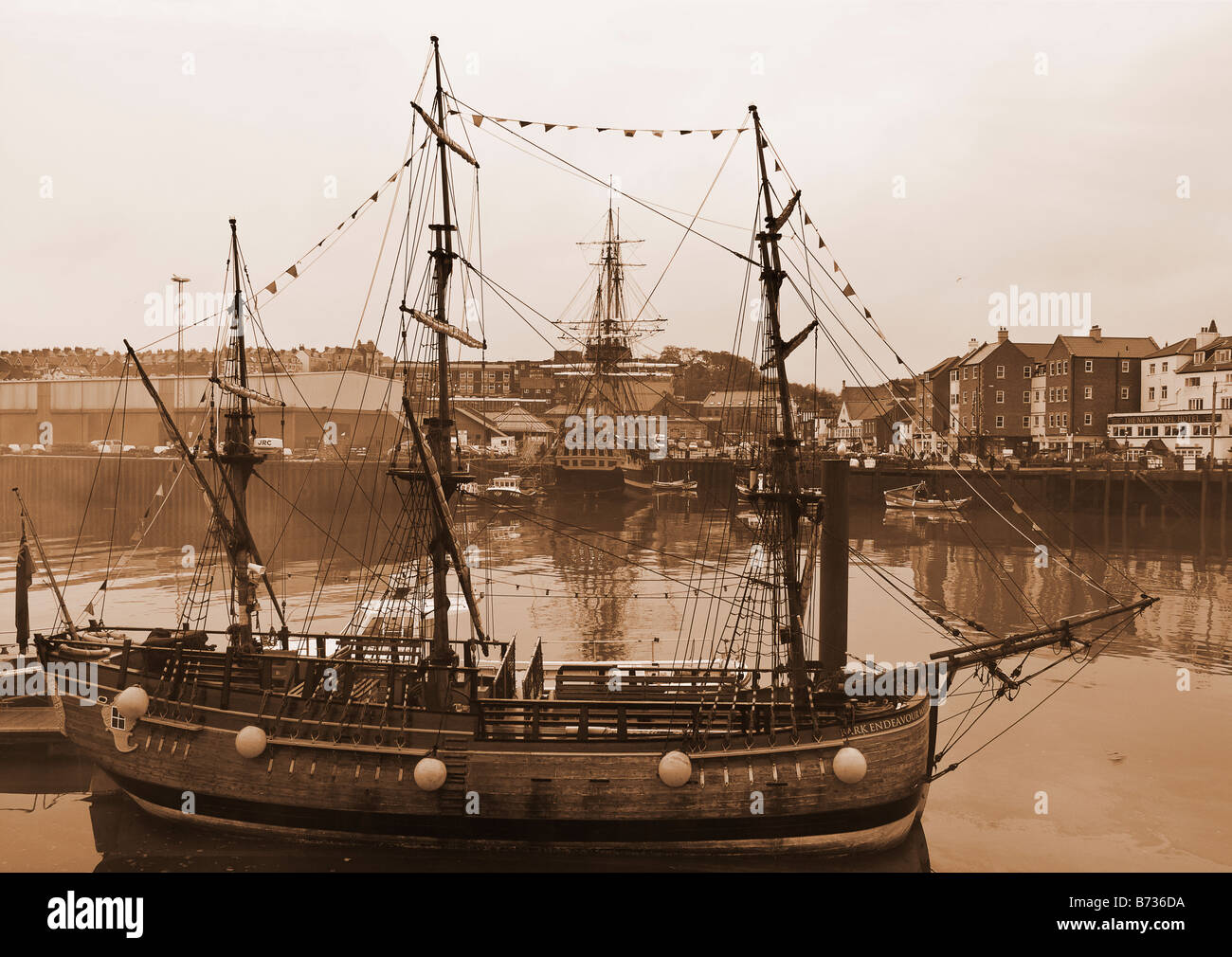 Sepia toned image of two tall ships moored in the inner harbour at ...