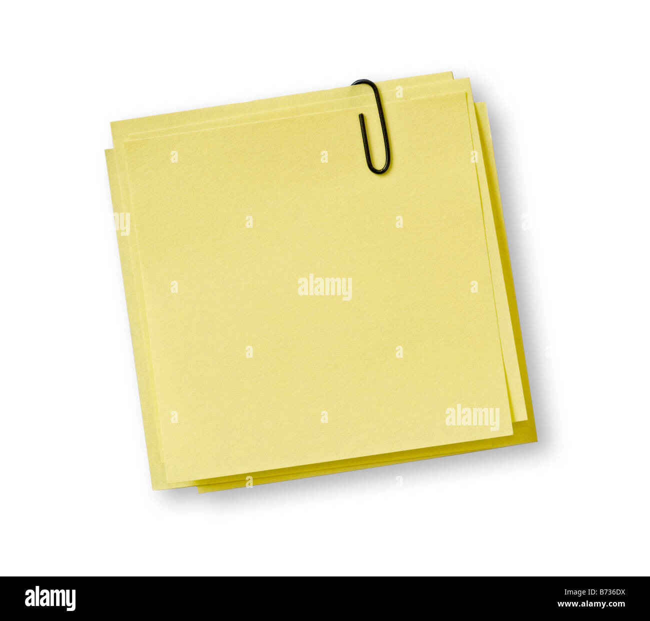 yellow notes with black clip over white background Stock Photo - Alamy