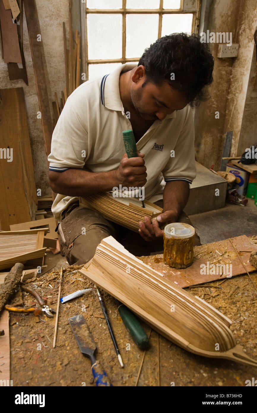 Making model boats and ships in factory in Mauritius Stock Photo - Alamy