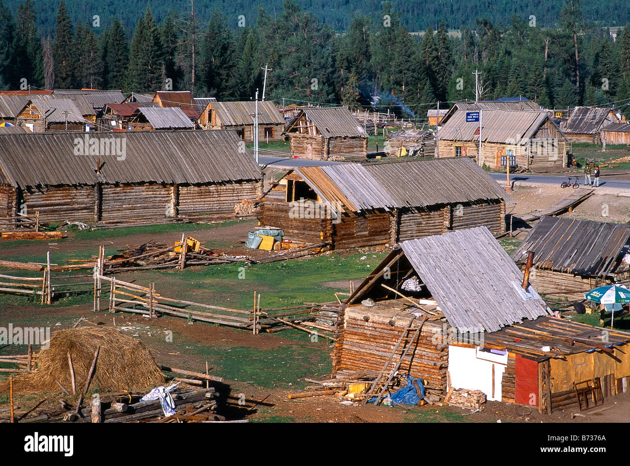 Log houses at Tuwa village in Kanas national park in Xinjiang in China ...