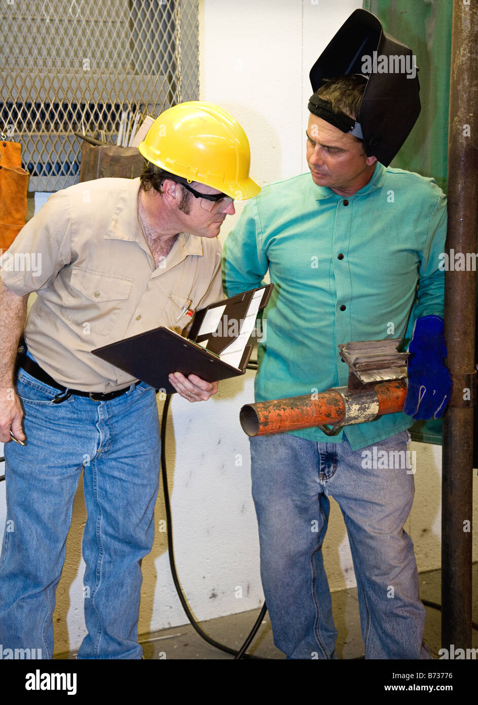 Qualtiy control inspector checking the metal work of a professional ...