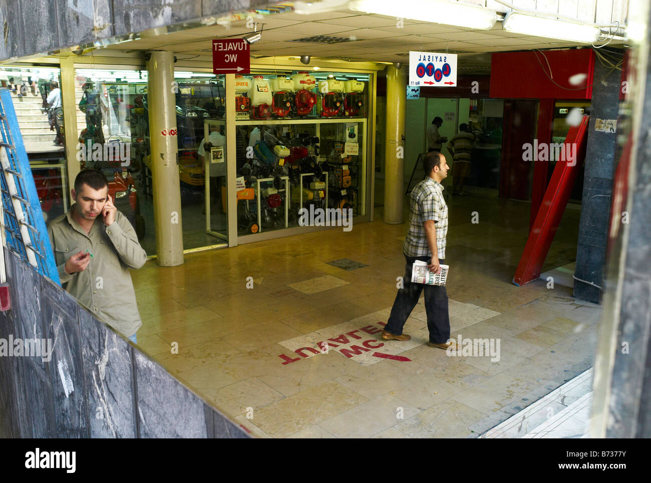 01 July 2008 Two men in an underground passageway mirror in Istanbul ...