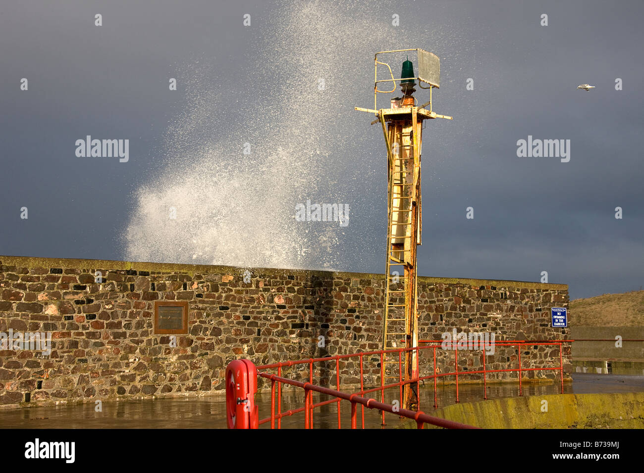 Waves harbour wall hi-res stock photography and images - Alamy