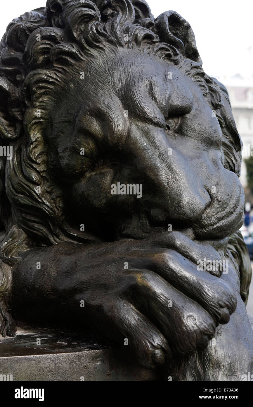 Sleeping lion statue Stock Photo - Alamy