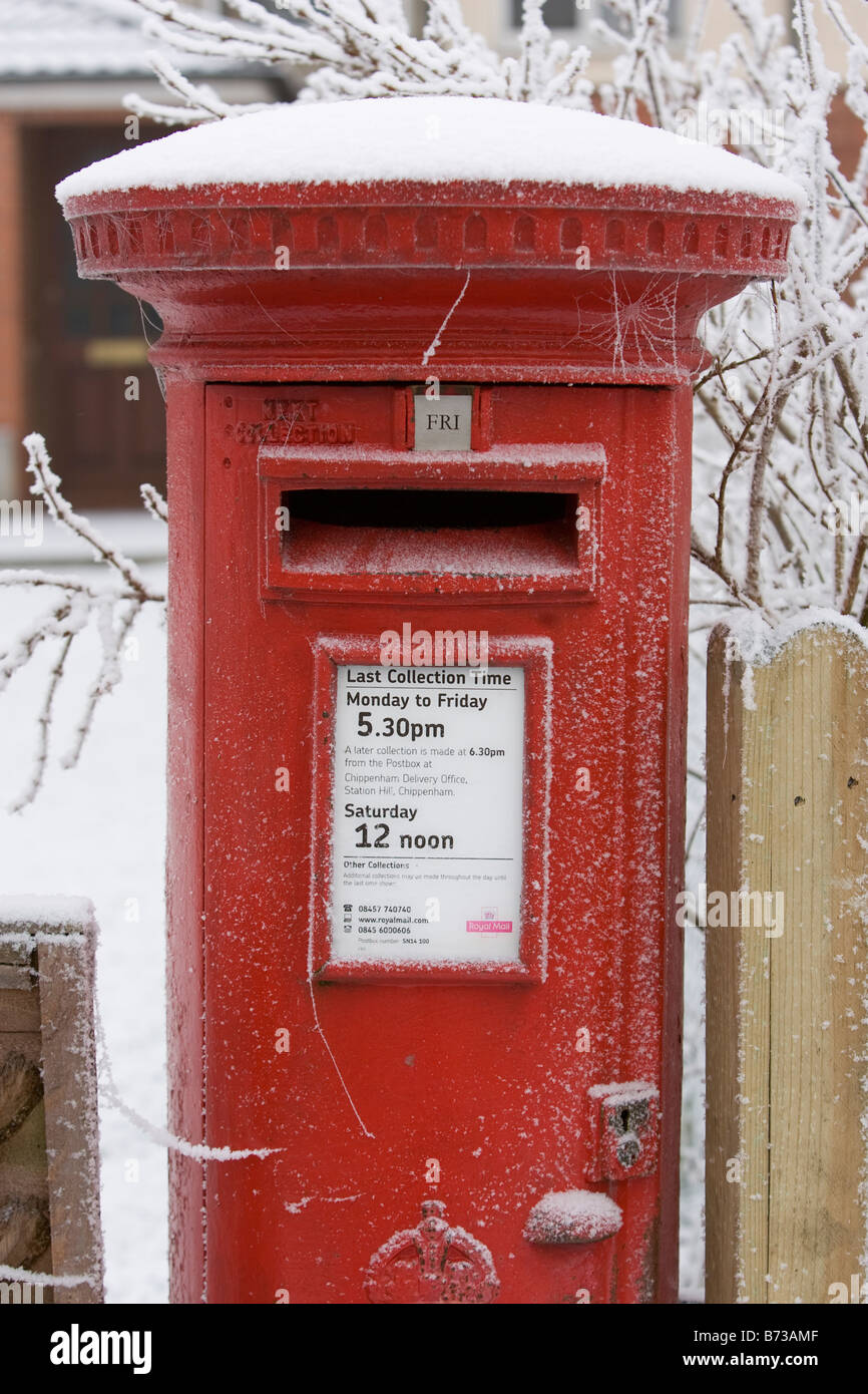 A royal mail red post box covered with snow Stock Photo - Alamy