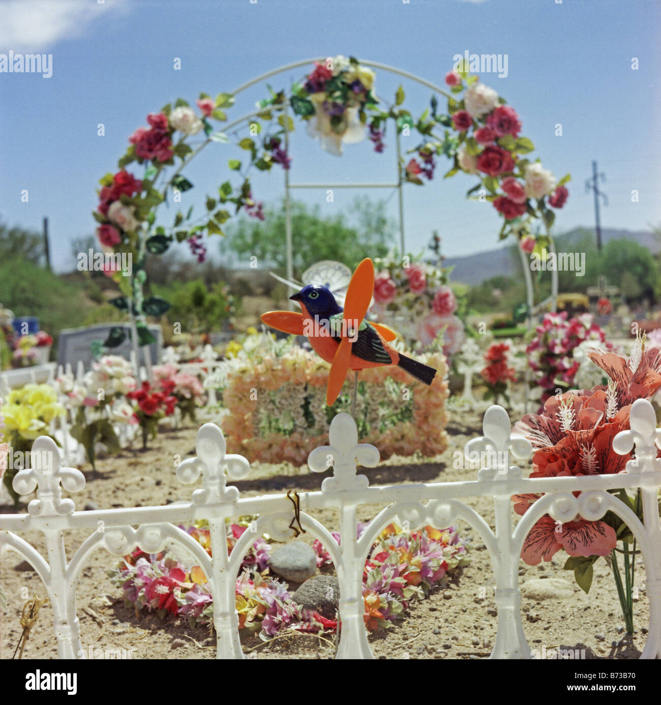 bird windmill in graveyard bright colors Stock Photo - Alamy