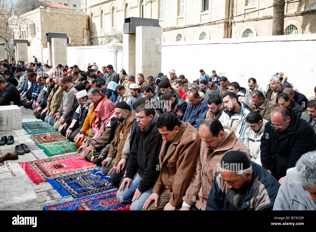 Palestinian Muslims praying outside the Al Aqsa mosque in the Old City ...