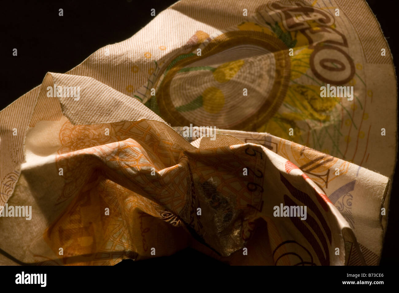 a crunched up ten pound note Stock Photo - Alamy