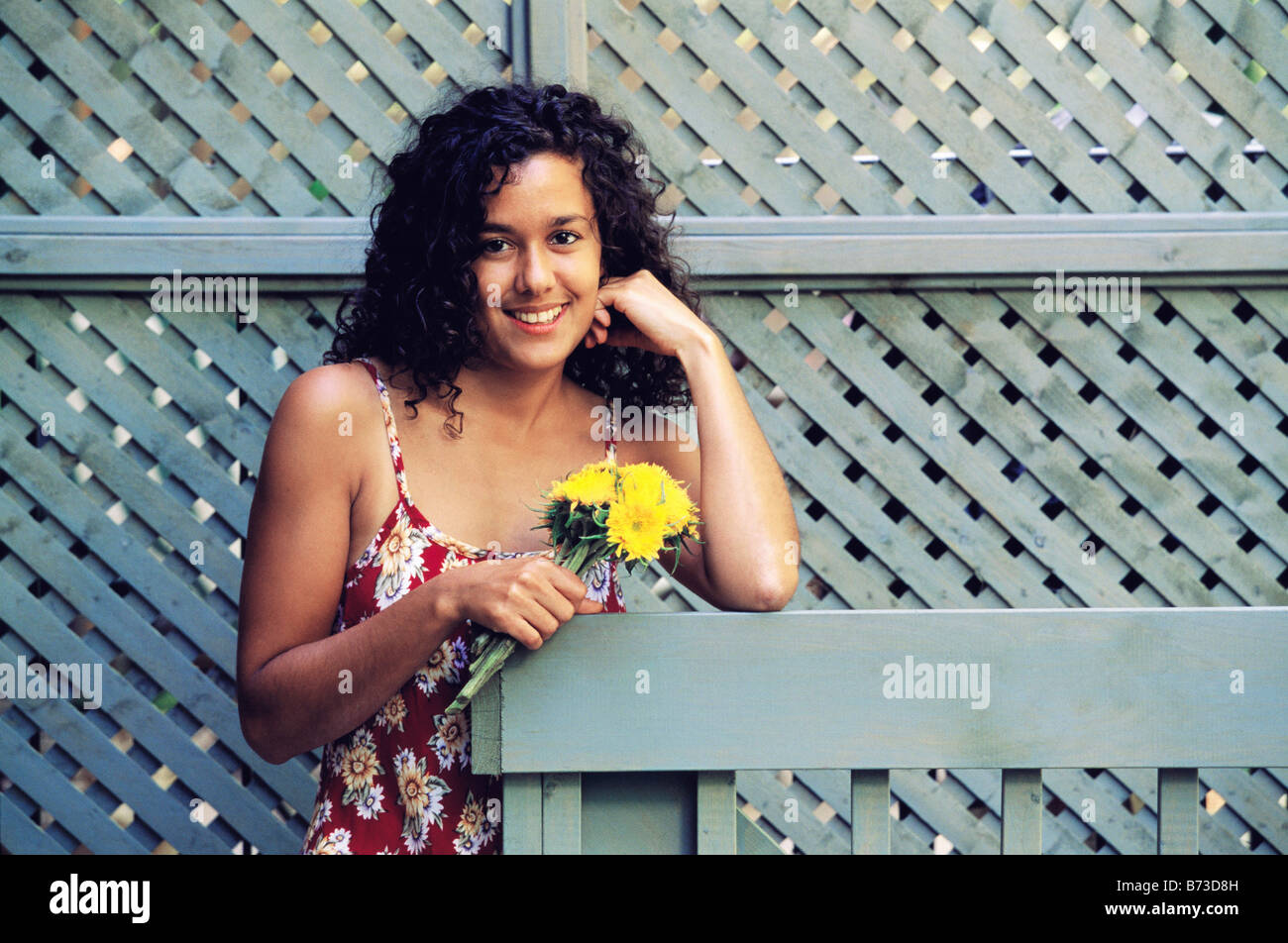 20 year old mulatto mixed race woman wearing a flowered red summer ...