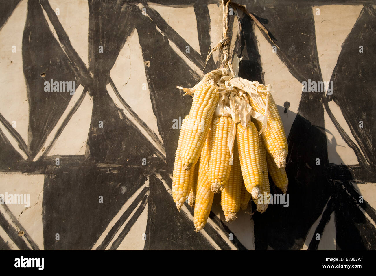 corn hung on wall of Painted mud buildings in Tiebele Stock Photo - Alamy