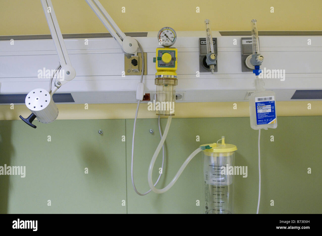saline drip feed apparatus in a hospital wall Stock Photo - Alamy