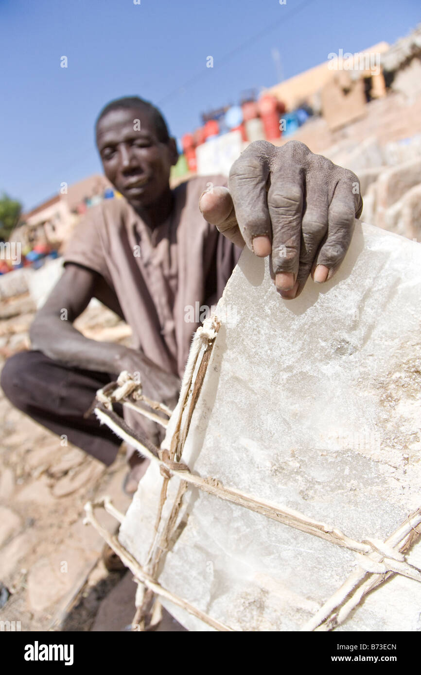 Man with block of salt Stock Photo - Alamy
