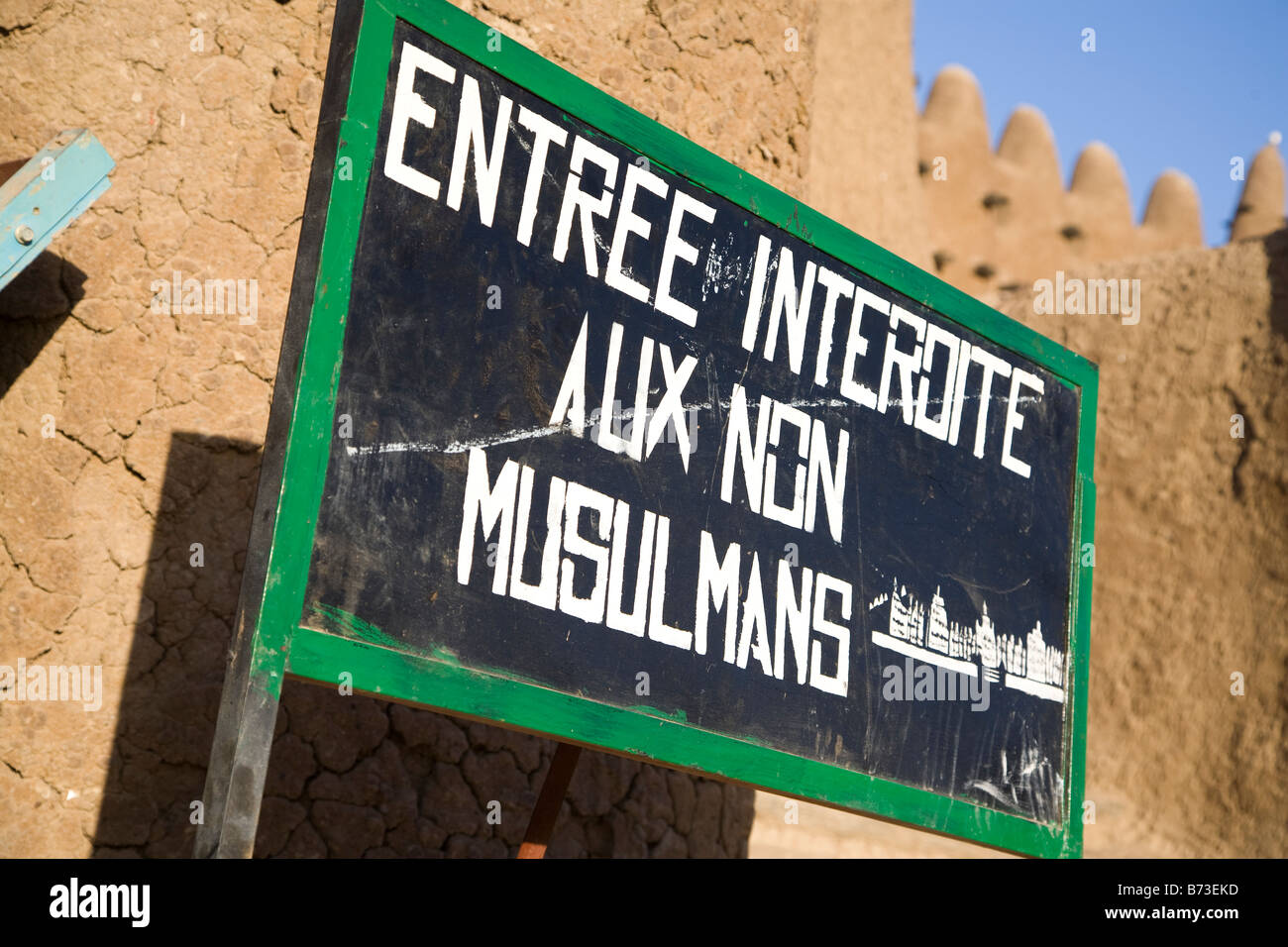 Sign at entrance to The Grand mosque in Djenne, Mali prohibiting non ...