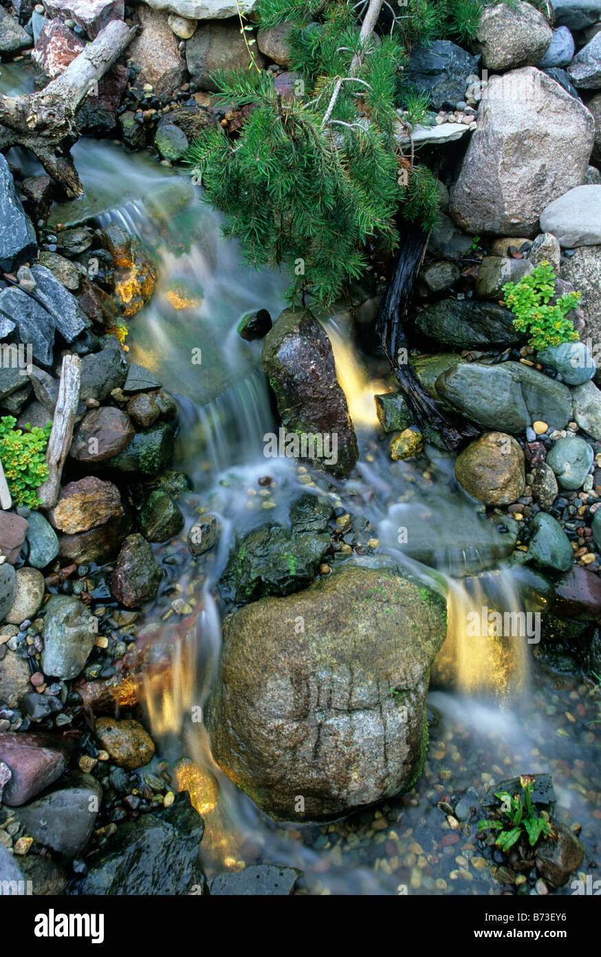 CHANGING COLORS BELOW GARDEN WATERFALLS CREATED BY UNDERWATER FIBER ...